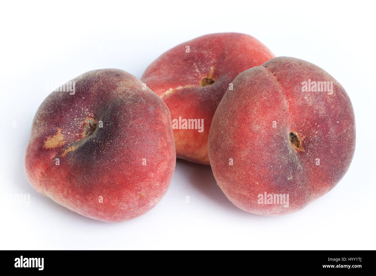 Flat nectarine isolated on white Stock Photo - Alamy