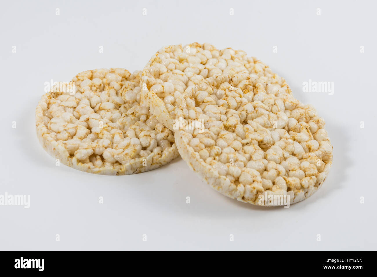 Puffed rice cakes on a white background Stock Photo - Alamy