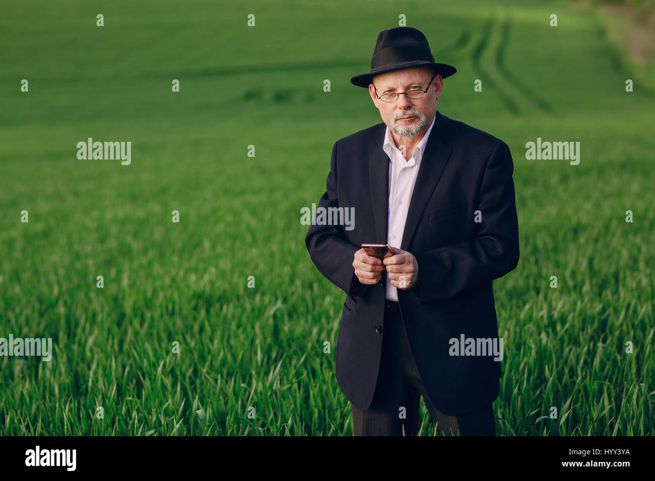 old man in field Stock Photo - Alamy