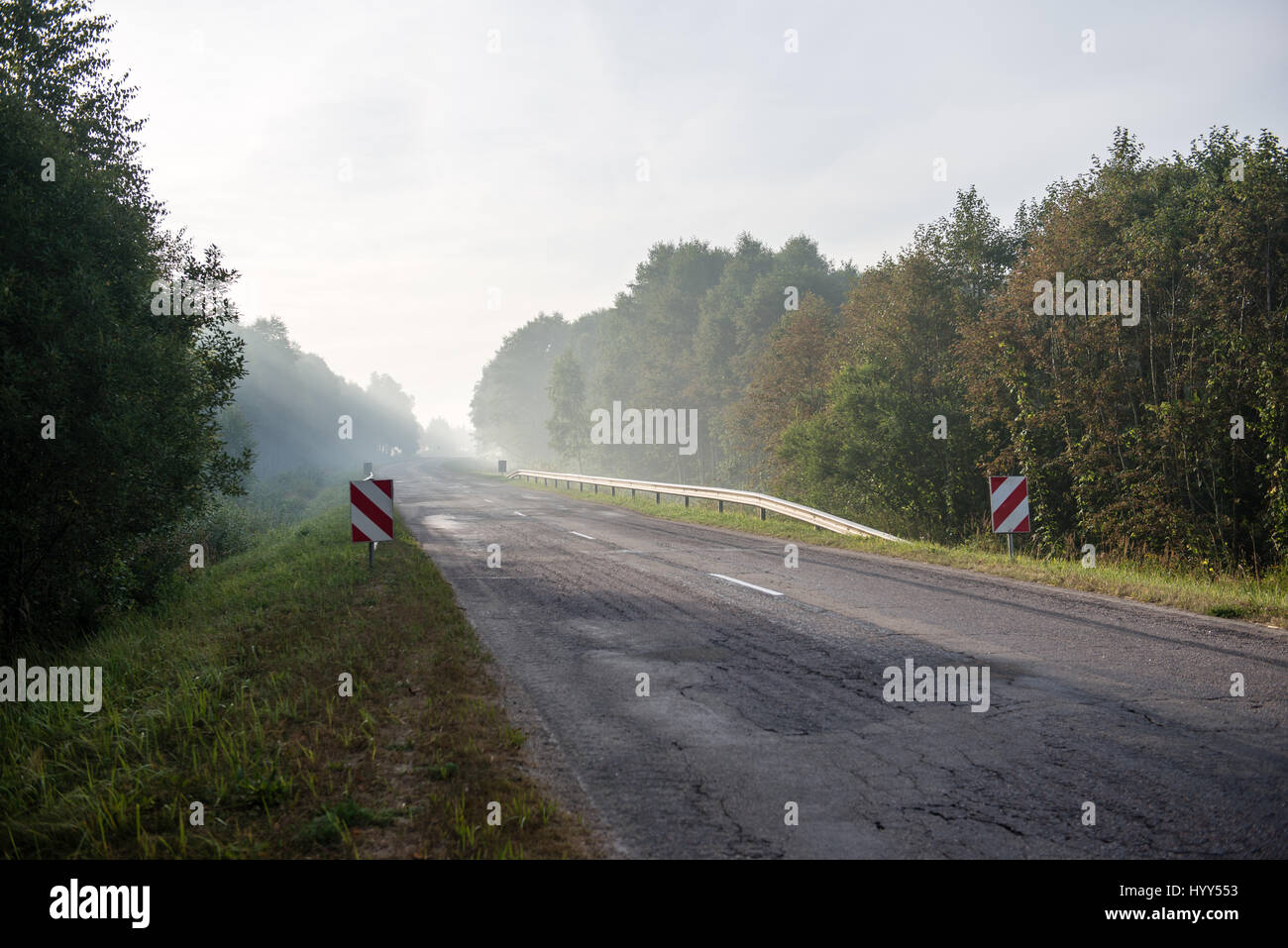 Light rays in fog over the road in country Stock Photo - Alamy