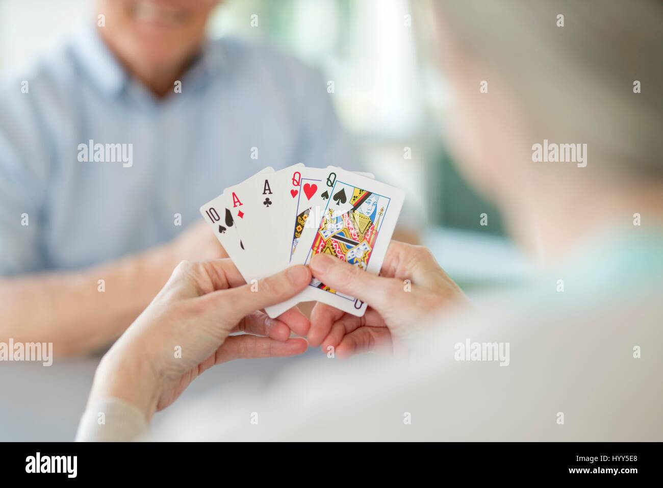 Playing cards woman hand cards hi-res stock photography and images - Alamy