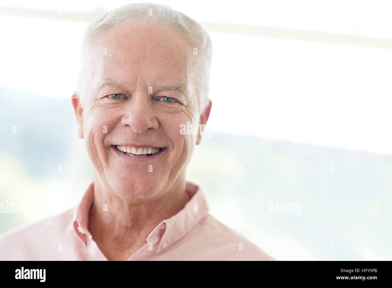 Senior man smiling at camera hi-res stock photography and images - Alamy