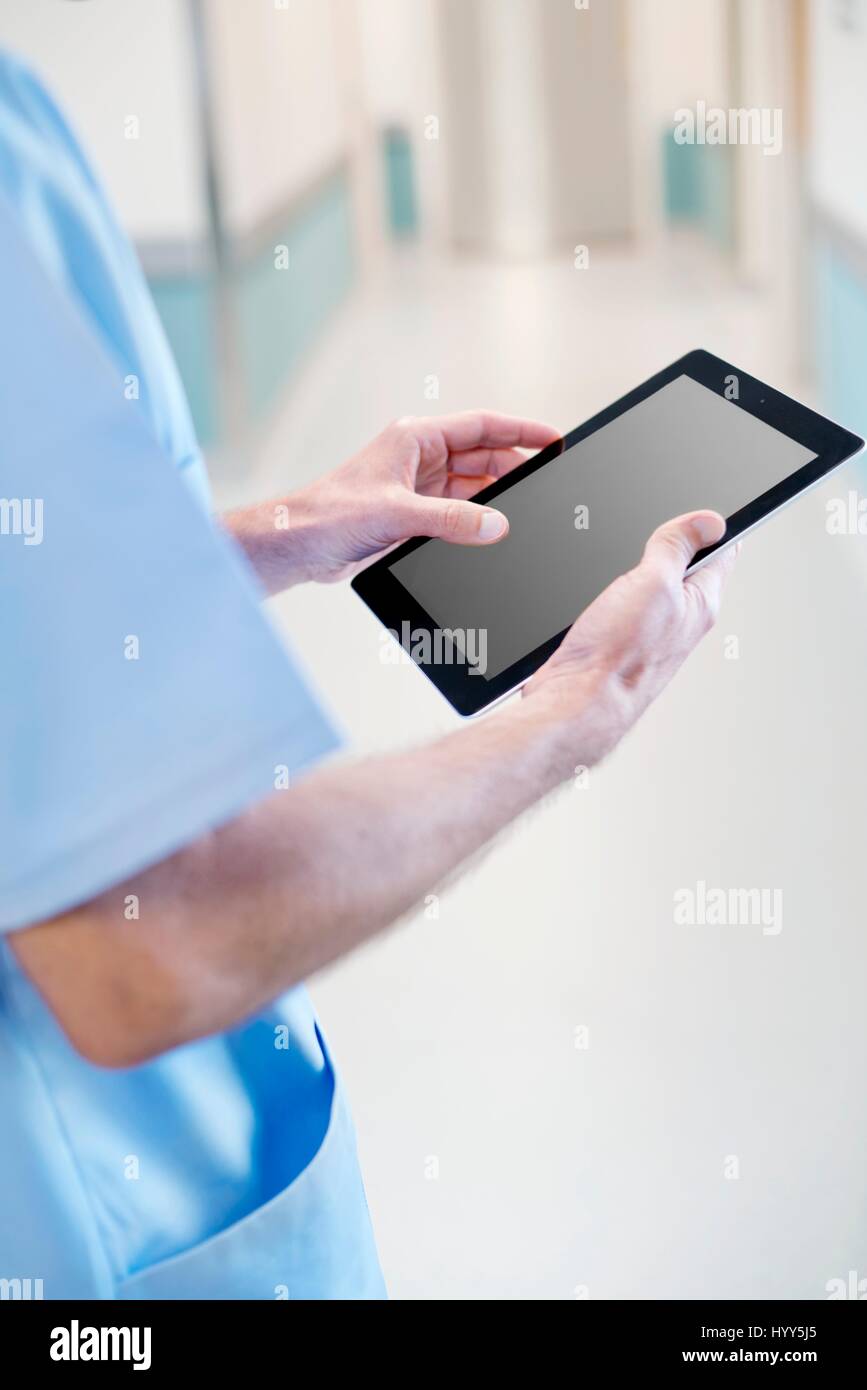 Doctor nurse using tablet touching hi-res stock photography and images ...