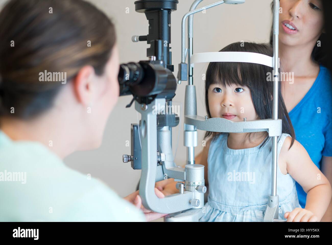 Girl having her eyes tested Stock Photo - Alamy