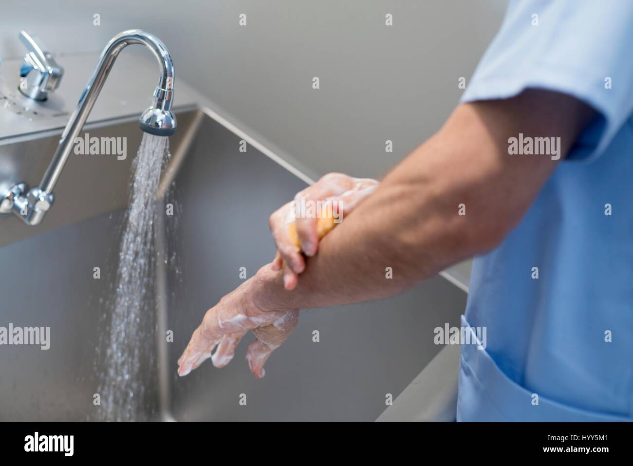 Doctor cleaning hands with soap and water in hospital Stock Photo - Alamy