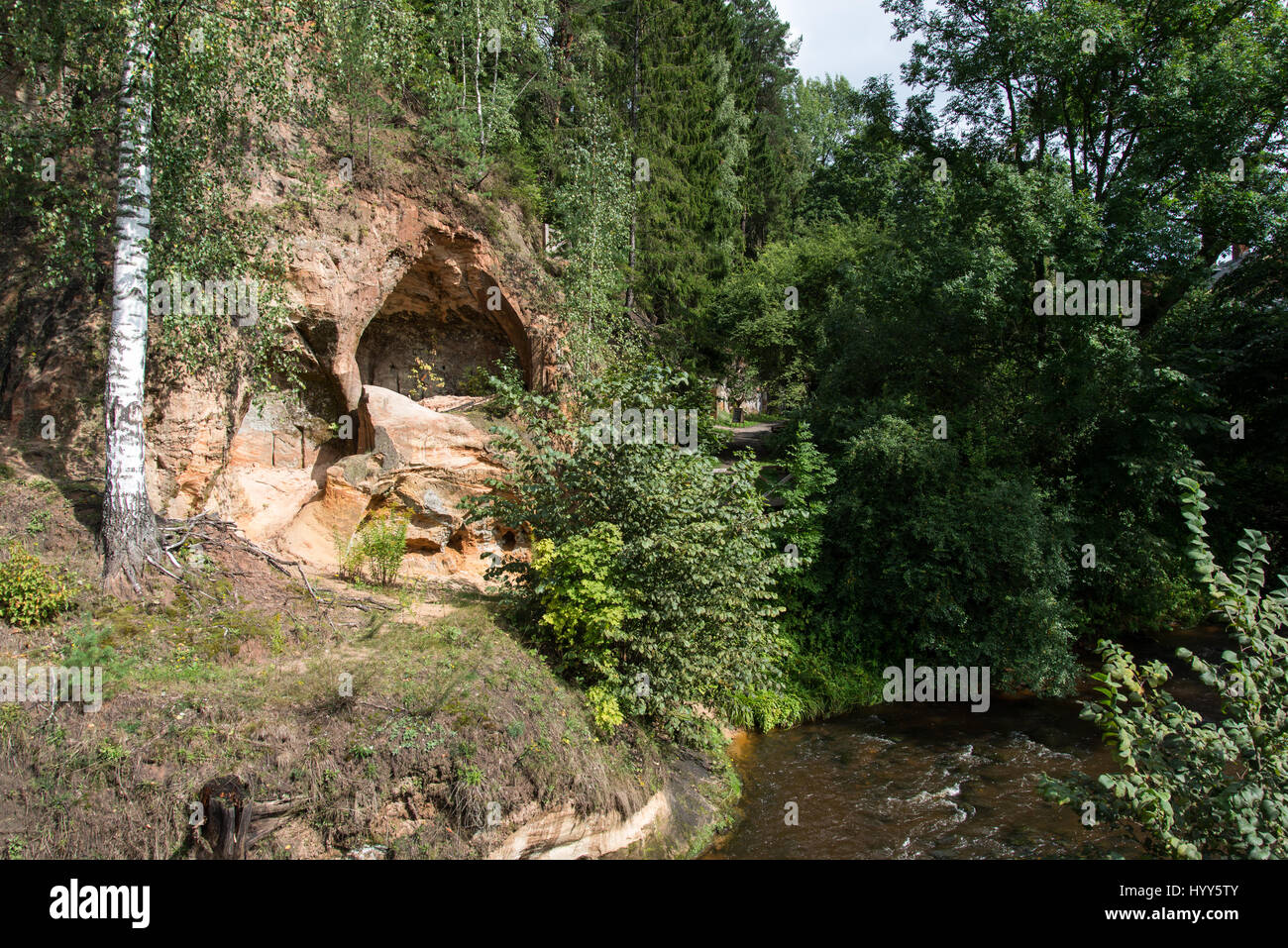 ancient sandstone cliffs with inscriptions in the Gaujas National Park ...