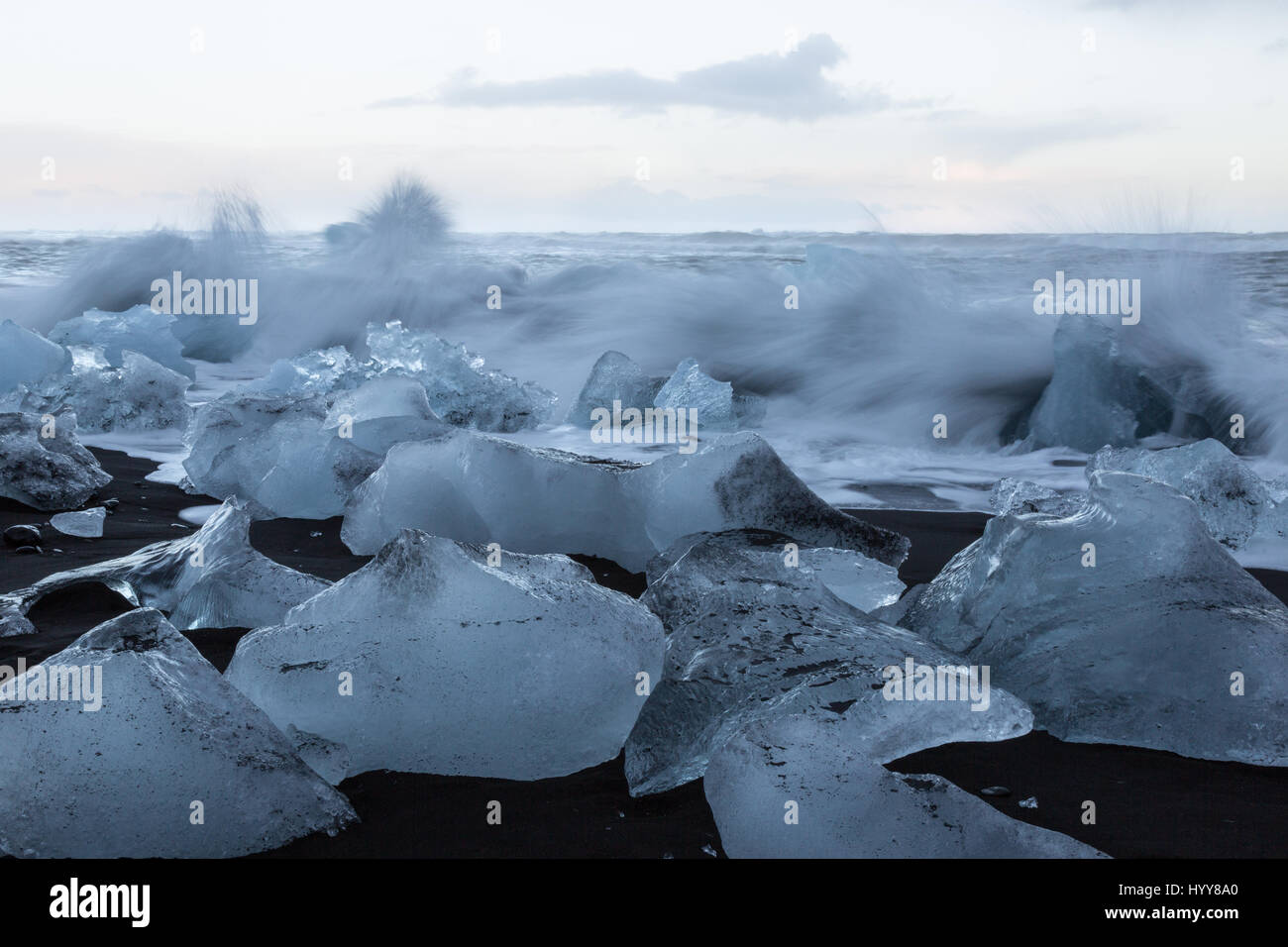waves crashing over glacial ice, Iceland Stock Photo - Alamy