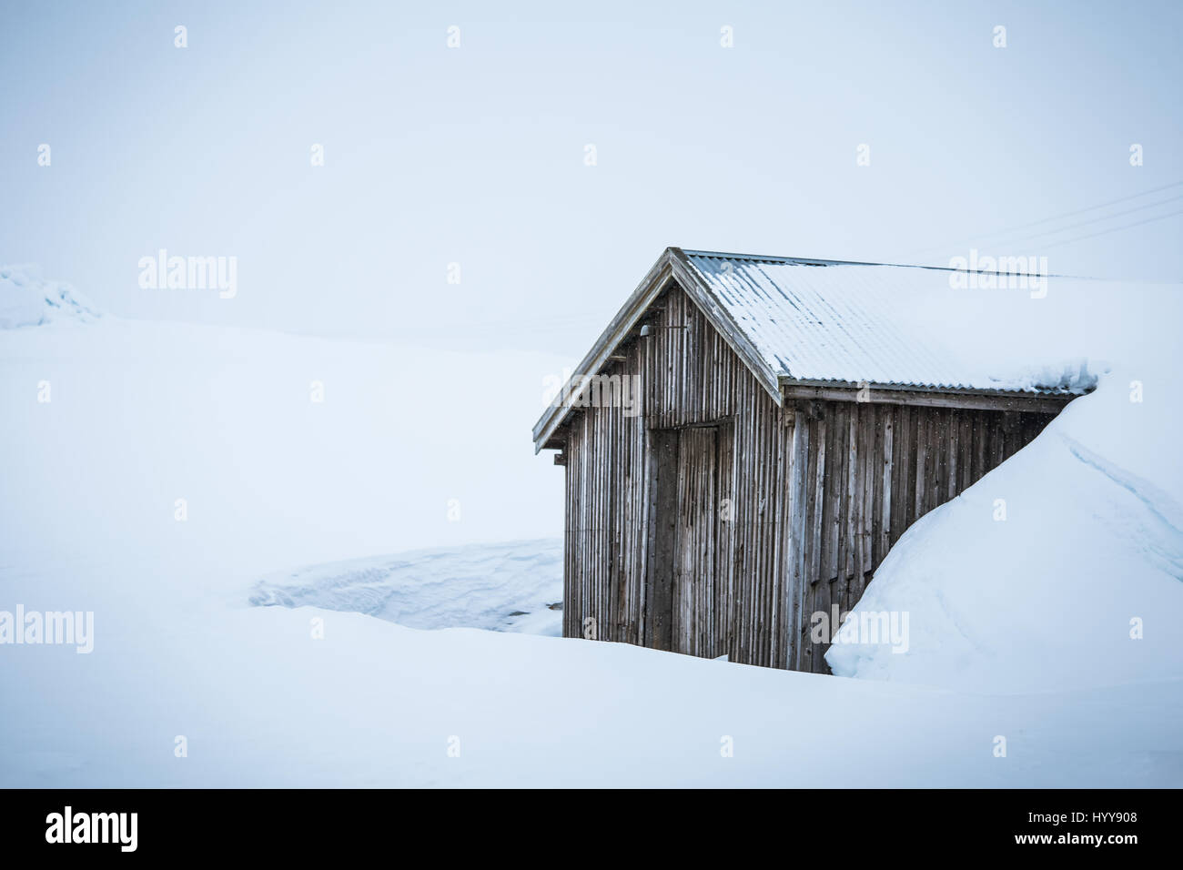 A beautiful, minimalistic landscape of a house in the snow in Norway ...