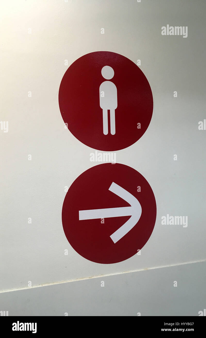 Male toilets this way Stock Photo - Alamy