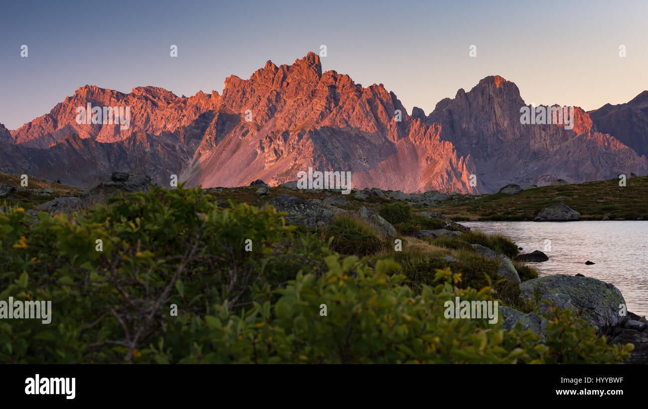 Reddish mountain peaks at sunrise. Vallée de la Clarée. Crête du Diable ...