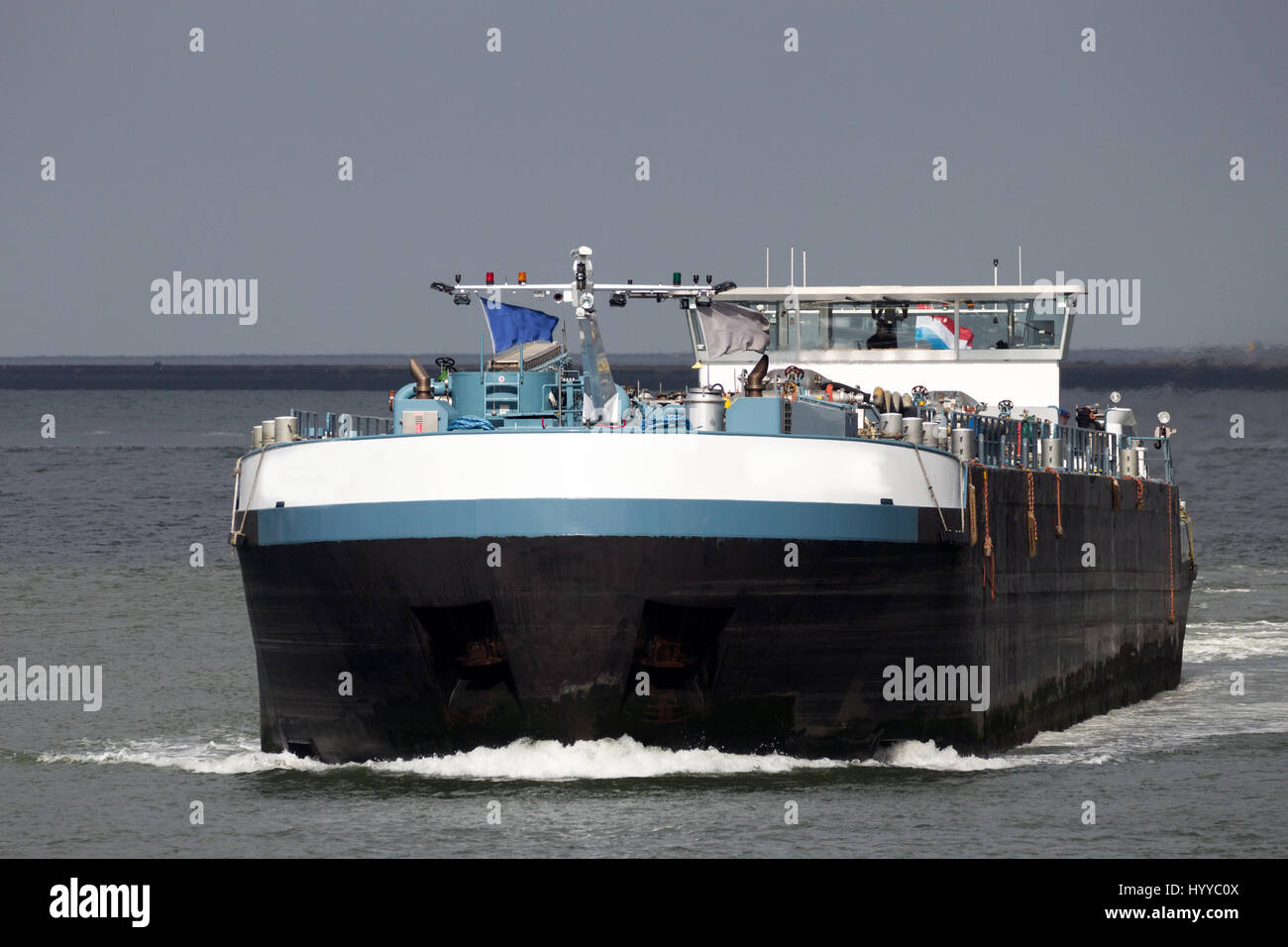 Front view of a barge moving on a river Stock Photo - Alamy
