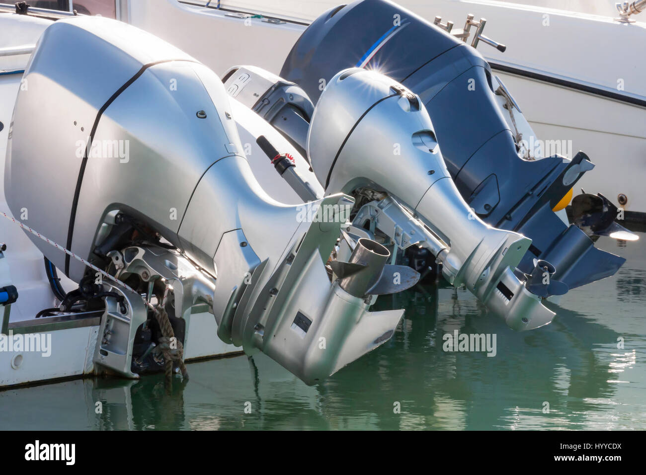 Outboard engines at rest in harbor Stock Photo - Alamy