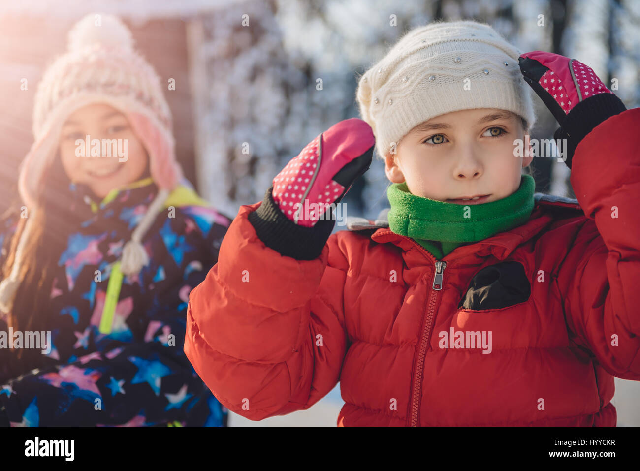 Child putting on jacket hi-res stock photography and images - Alamy
