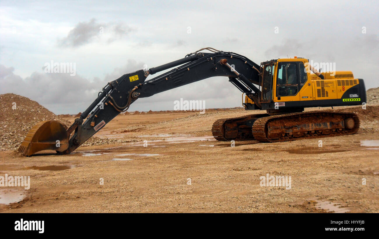 Excavator machine on the construction site in the Arabian desert Stock ...