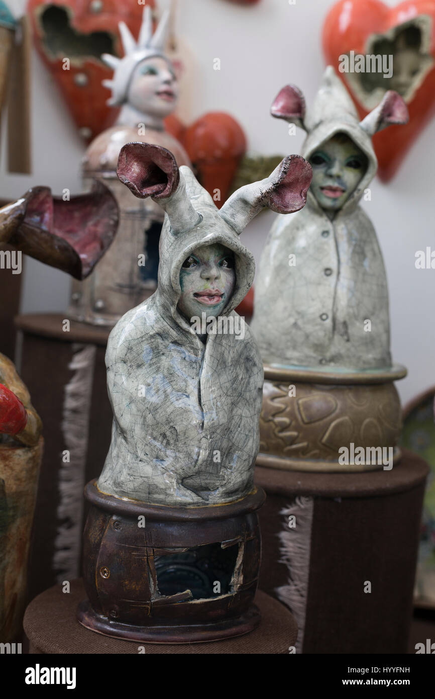 strange looking figurines with hoods and trumpeted ears Stock Photo - Alamy