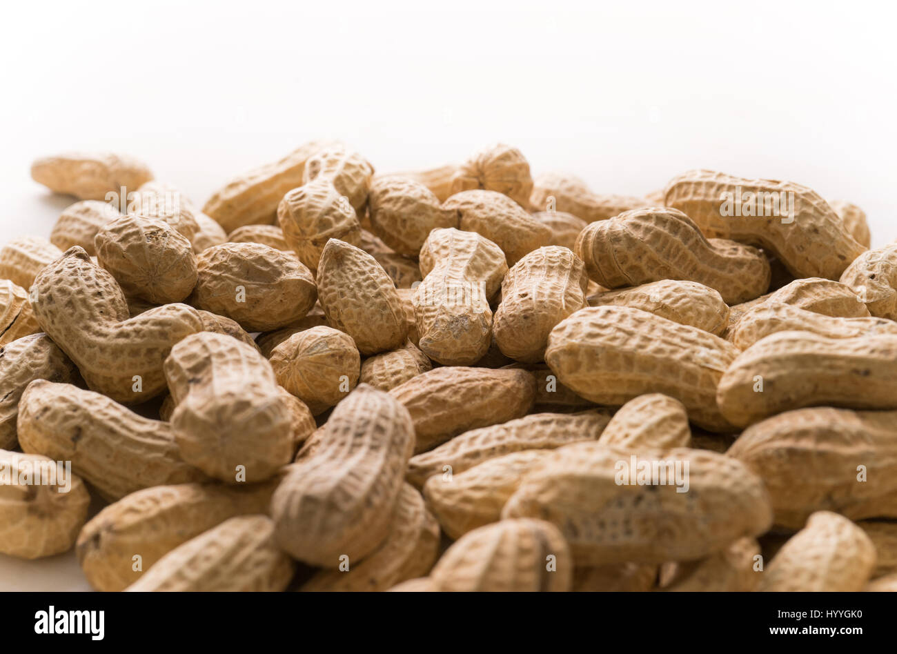 Peanuts on a white background Stock Photo - Alamy