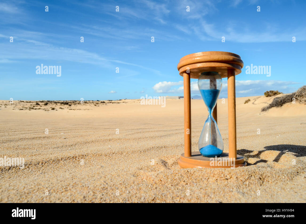 Conceptual Photo Picture of an Hourglass Object in the Dry Desert Stock ...