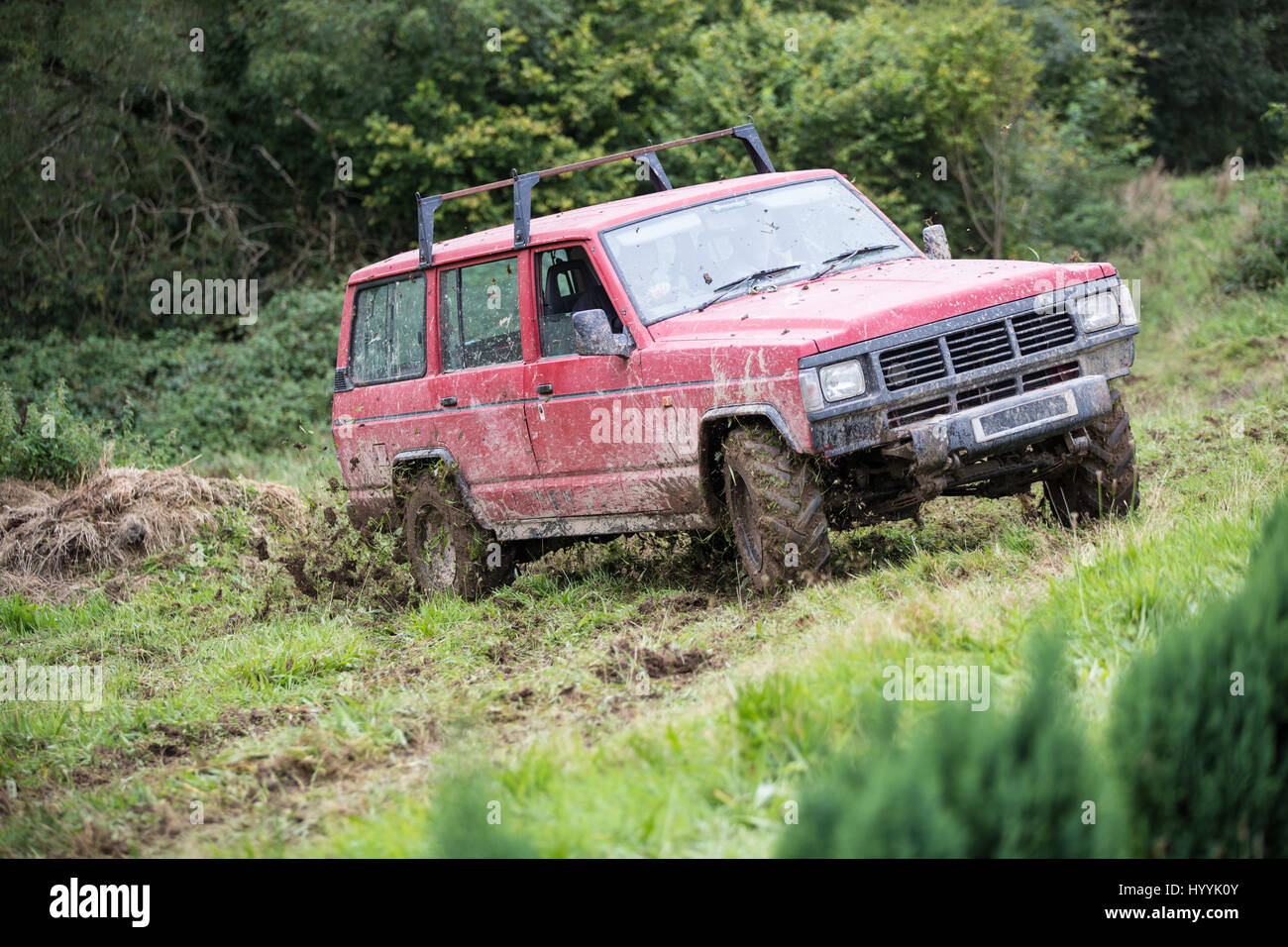 Off road 4x4 car on grass spraying mud up and having fun Stock Photo ...