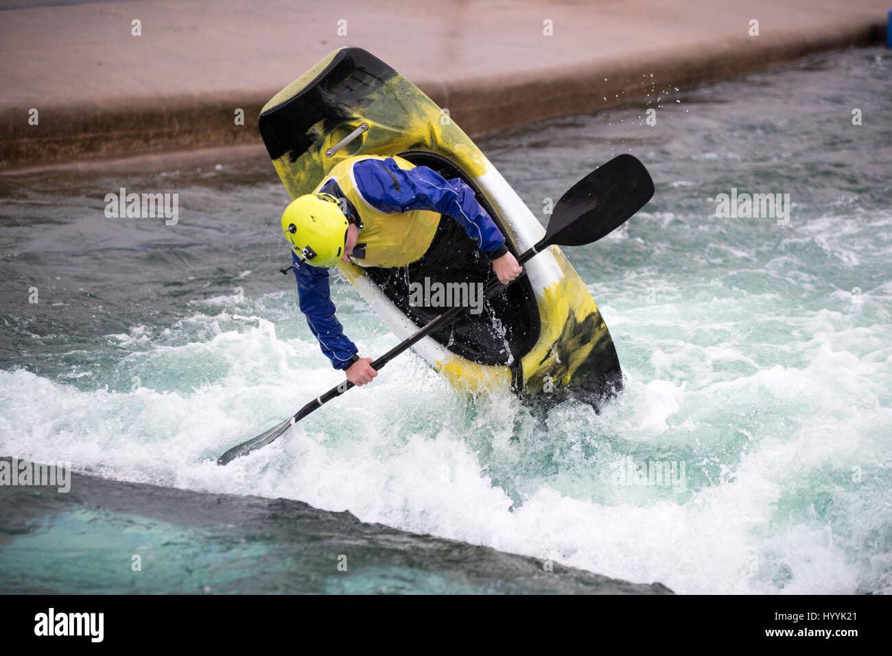 Man vertical upright ina play boat kayak he is about to go underwater ...