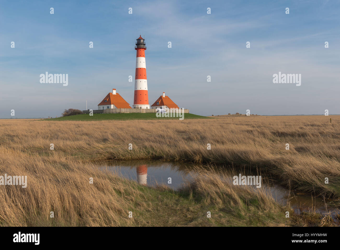Germany´s most famous lighthouse Westerheversand in the salt marshes of ...