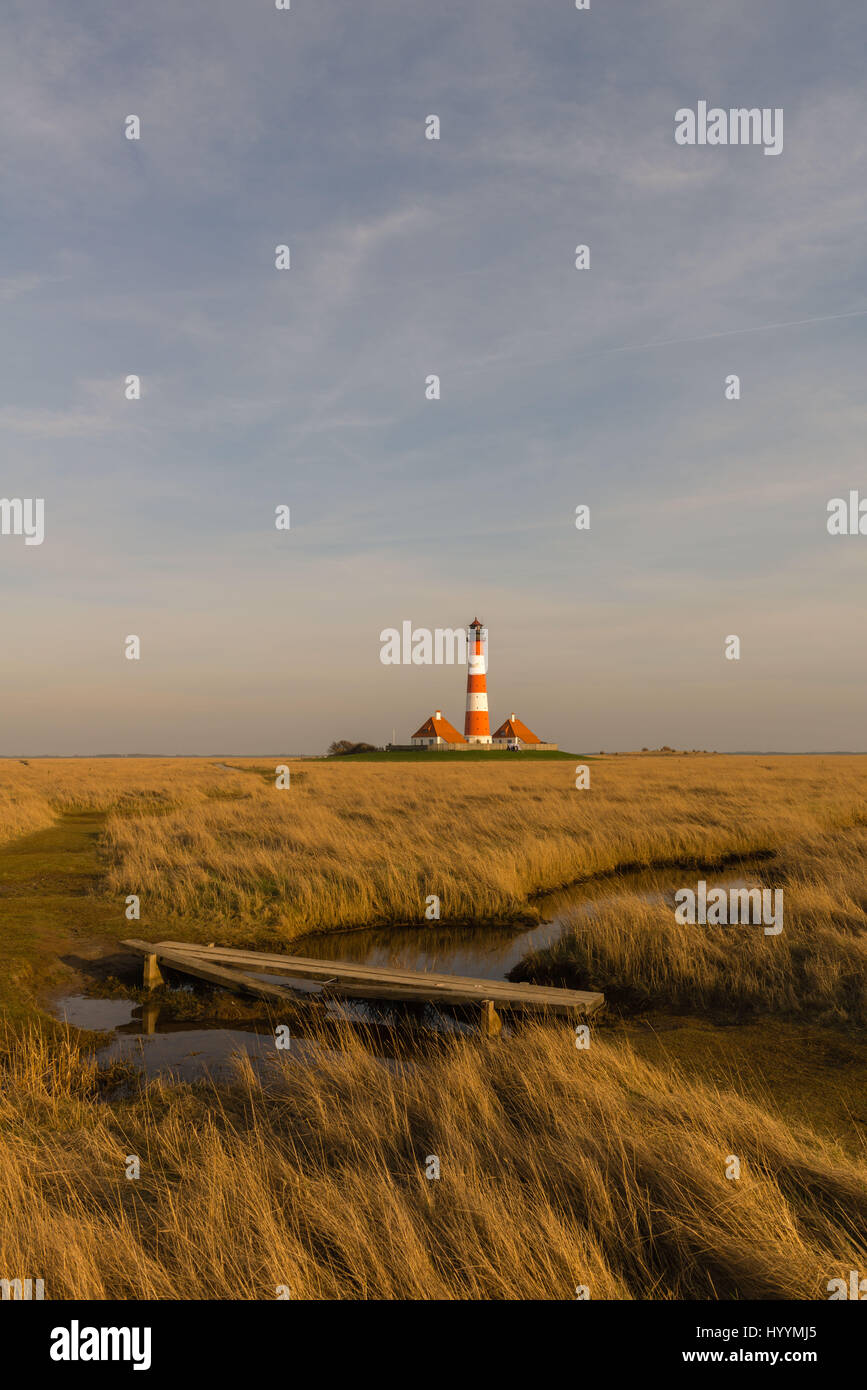 Germany´s most famous lighthouse Westerheversand in the salt marshes of ...