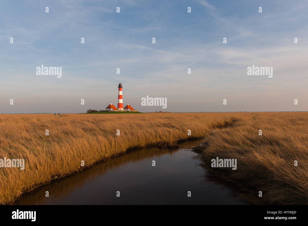 Germany´s most famous lighthouse Westerheversand in the salt marshes of ...
