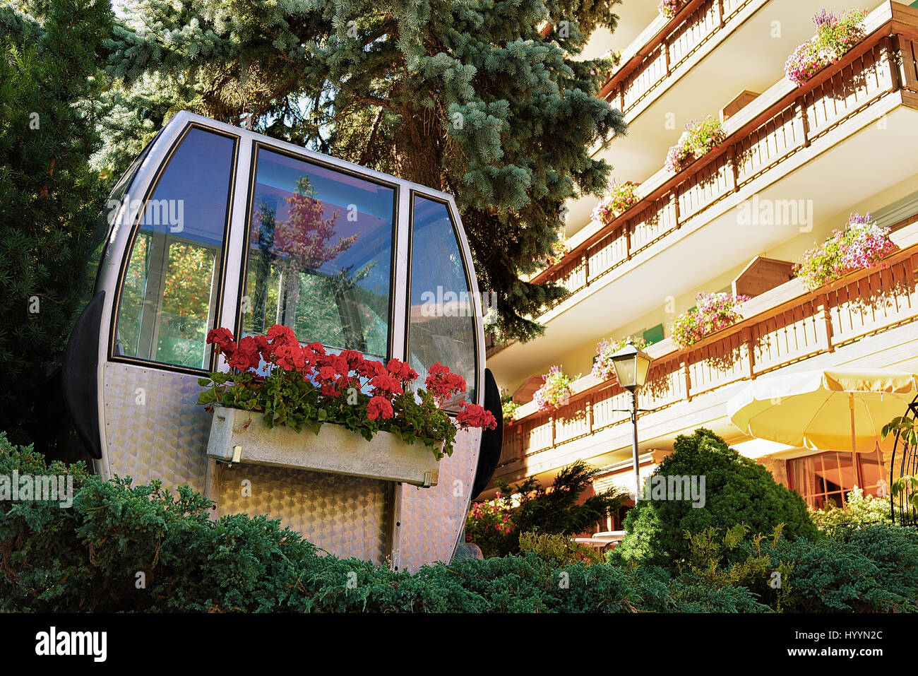 Old Cable car with flowers used for decoration purposes in Zermatt in ...