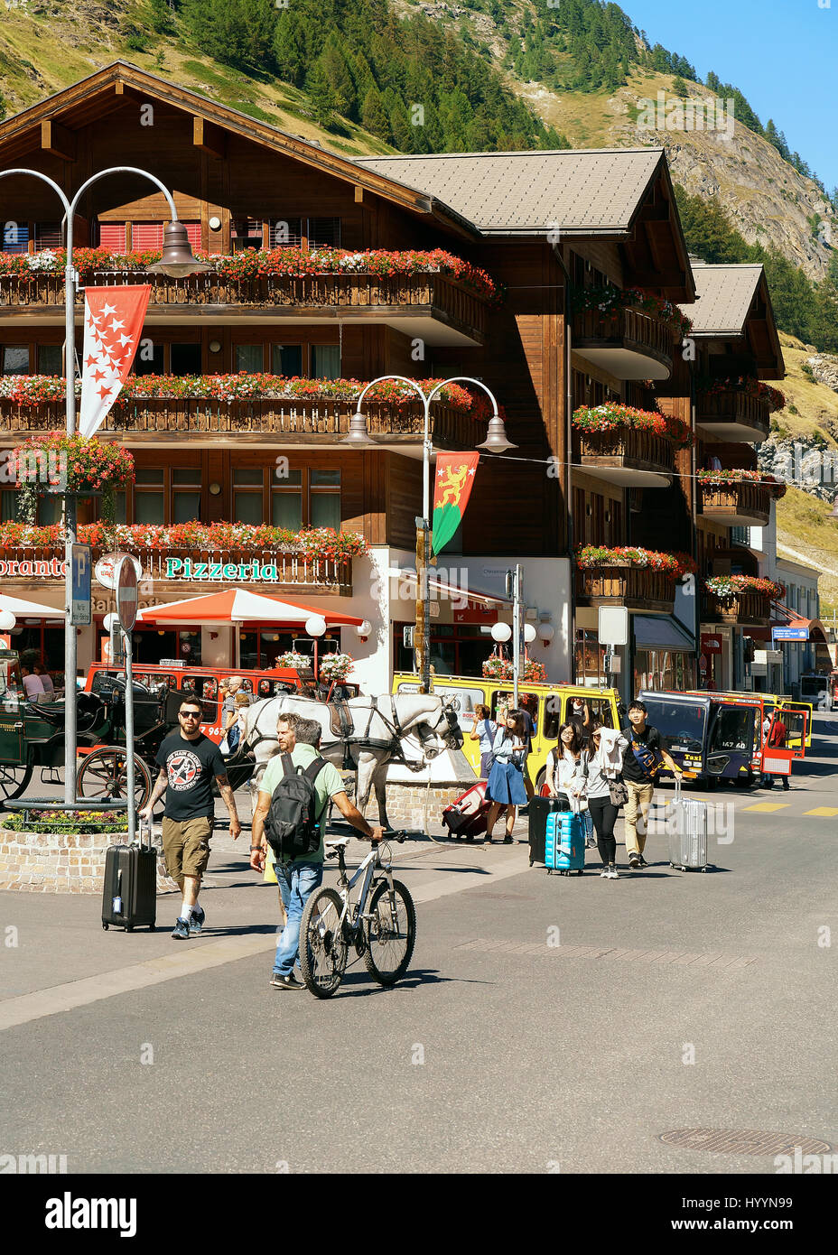 Zermatt, Switzerland - August 24, 2016: Tourists at the city center in ...