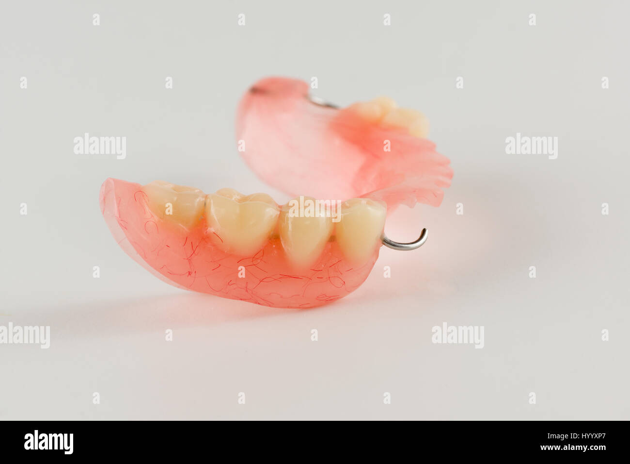 acrylic denture with metal clasps for restoring dentition Stock Photo ...