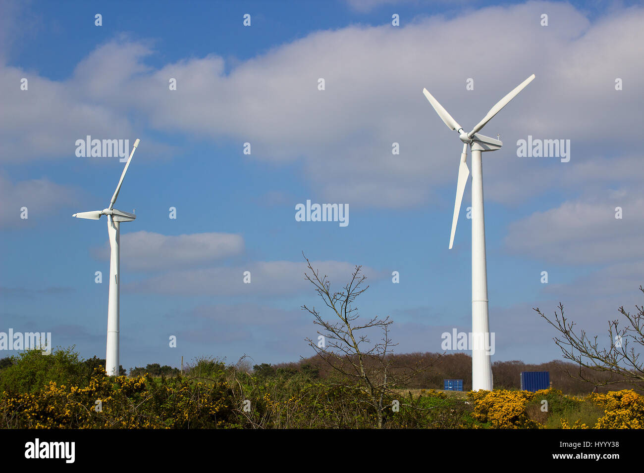 A pair of modern wind turbines located on the hill in the old lead ...