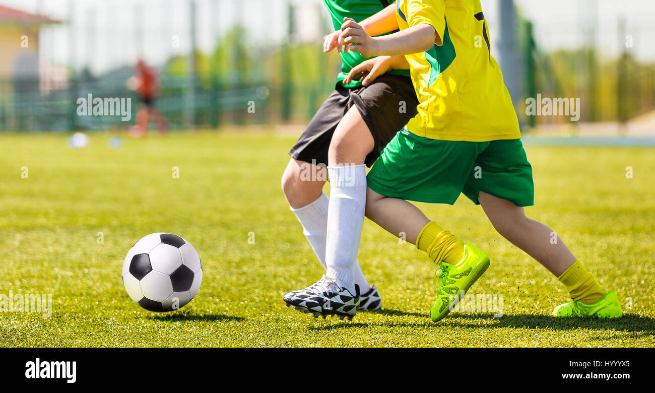 Training and football match between youth soccer teams. Young boys ...