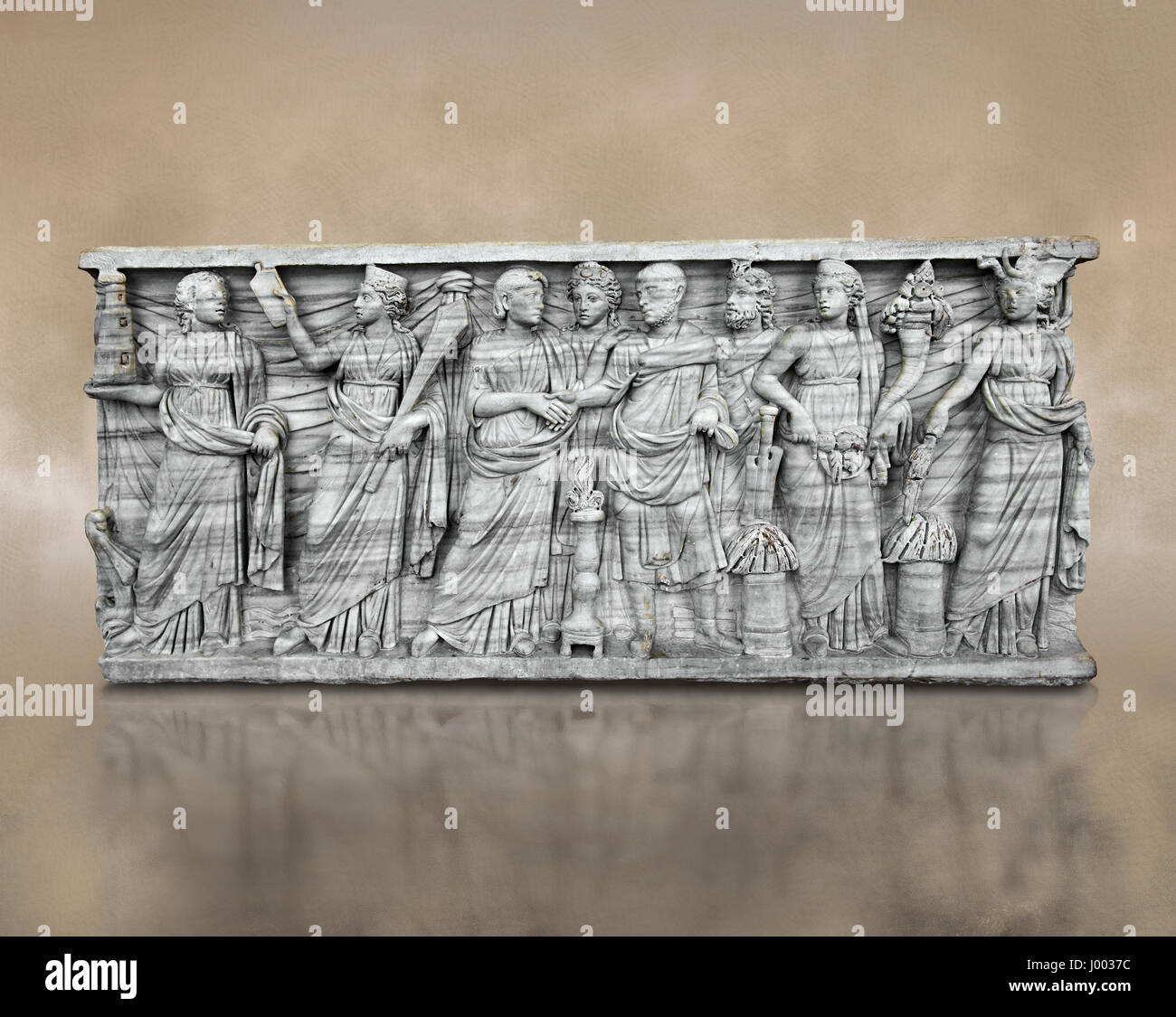 Roman relief sculpture sarcophagus showing a married couple with pagan ...