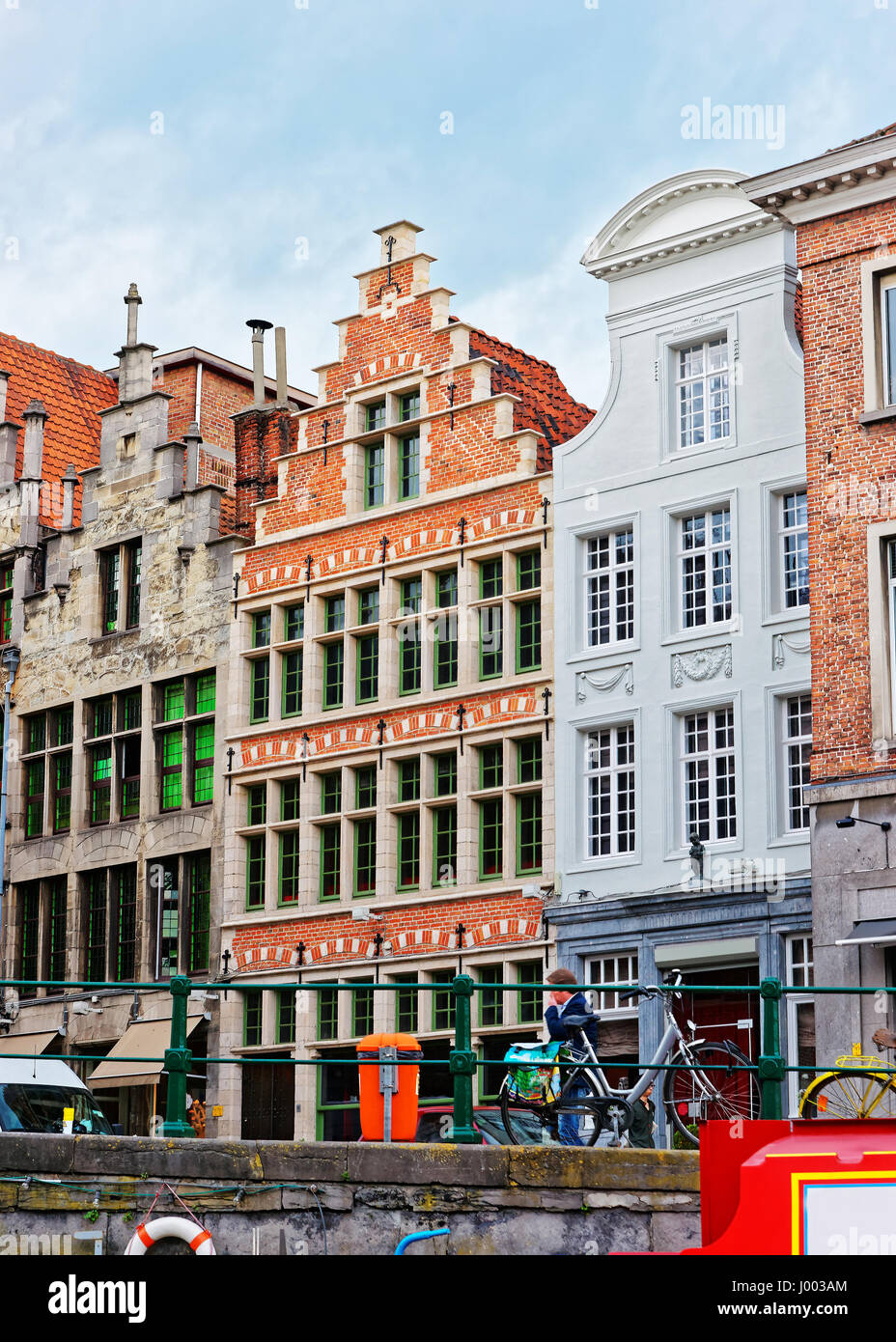 Guild halls on Graslei in Ghent in East Flanders, Belgium. People on ...