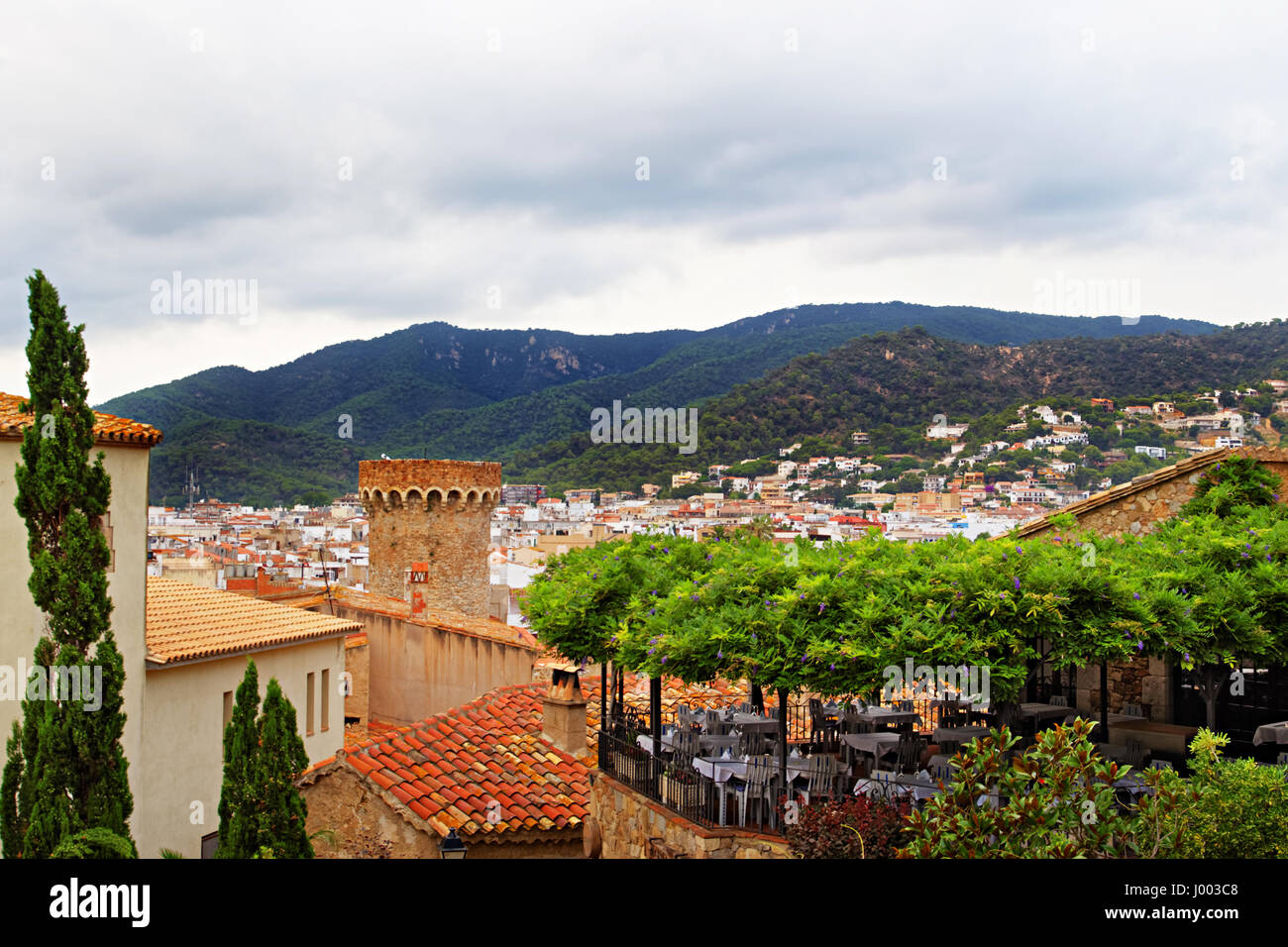 Medieval tower of the old fort and the roof top of town of Tossa de Mar ...