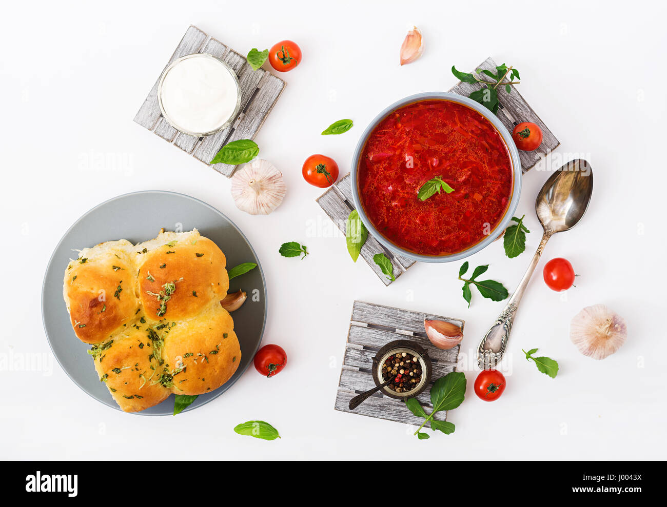 Traditional Ukrainian Russian vegetable borscht soup on blue bowl. Flat ...