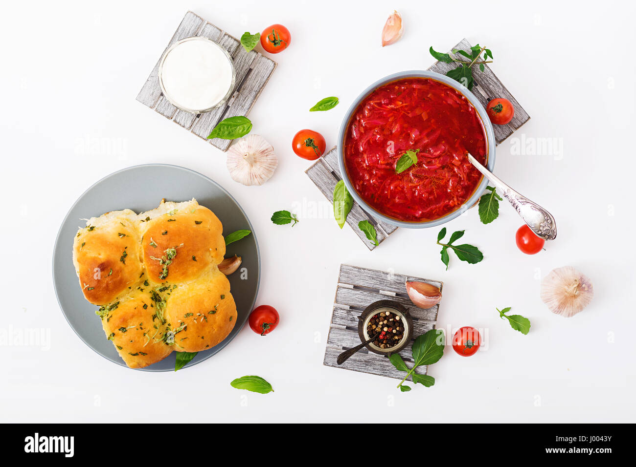 Traditional Ukrainian Russian vegetable borscht soup on blue bowl. Flat ...