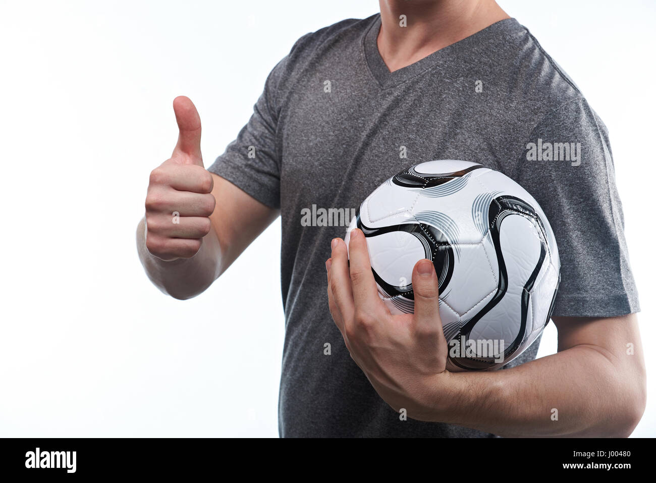 Excited football fan with ball closeup isolated on white background ...