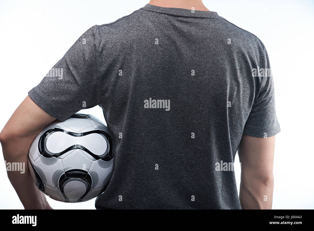 Back of football man holding ball close-up isolated on white background ...