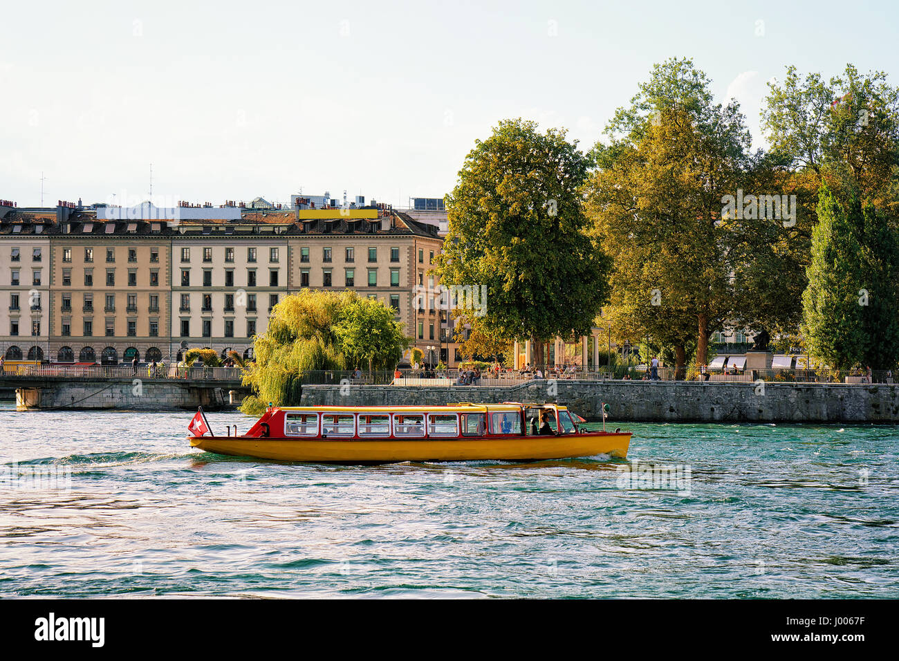Excursion ferry on Geneva Lake seen from the embankment of Promenade du ...