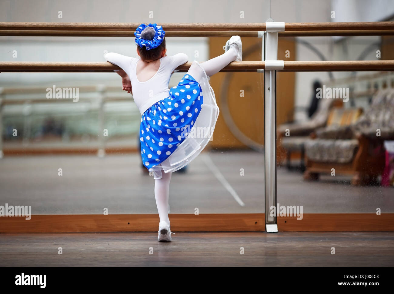 Child girl preparing for a dance performance in the ballet class ...