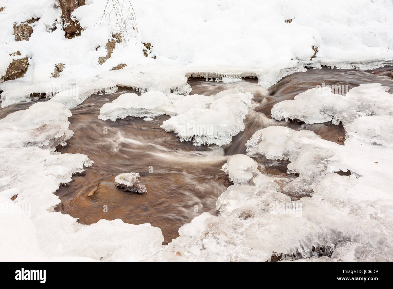 an beautiful waterfall in the snow with water Stock Photo - Alamy