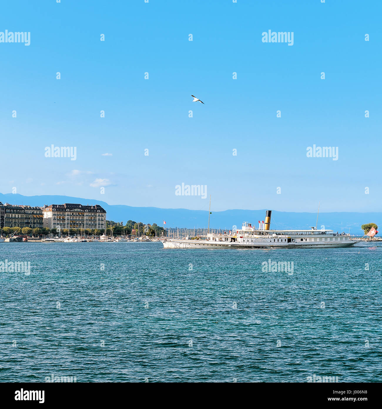 Steam ship on Geneva Lake seen from the embankment of Promenade du Lac ...