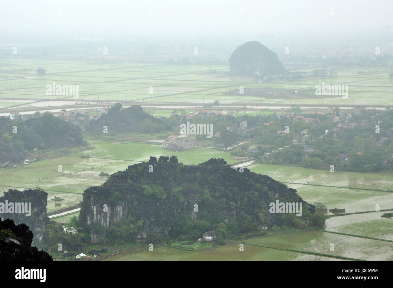 Panorama view of rice fields and limestone rocks from Hang Mua Temple ...