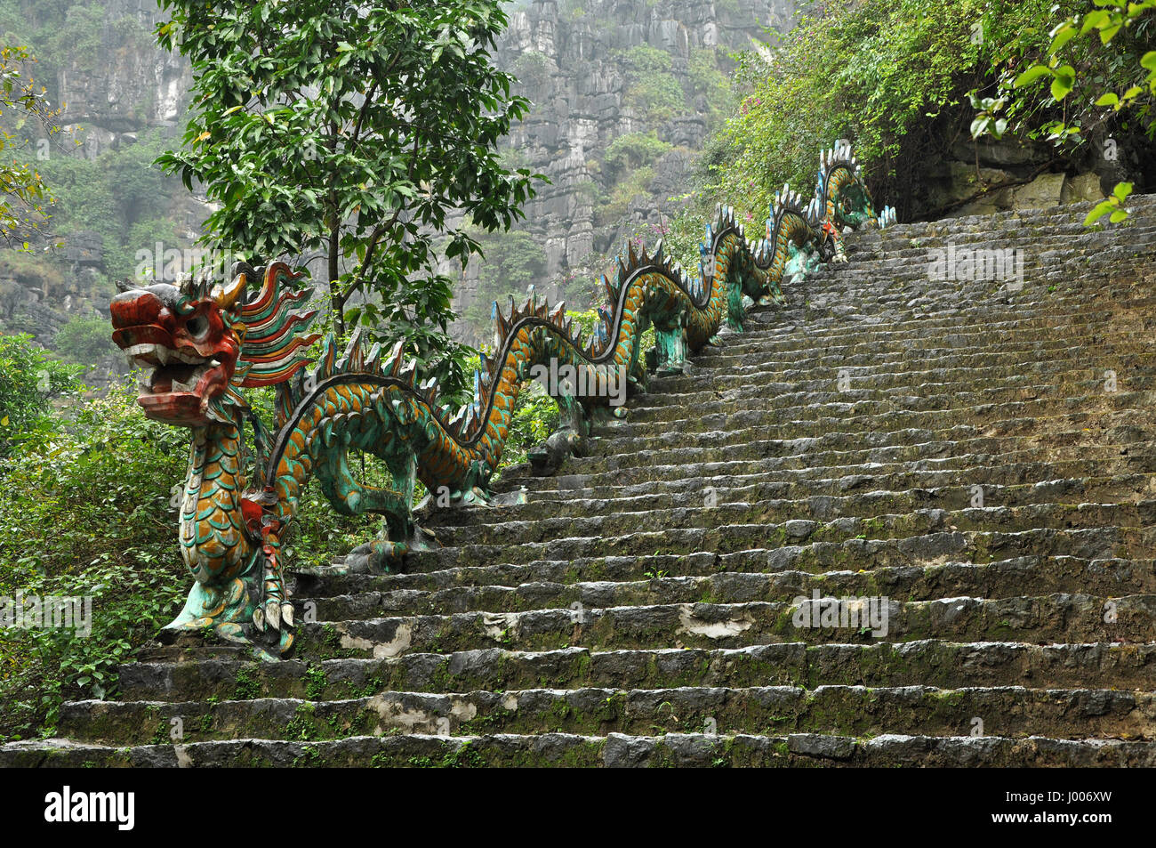 Carved stone dragon. Ascending stone staircase to Hang Mua pagoda and ...
