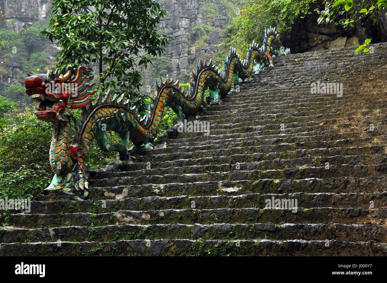 Carved stone dragon. Ascending stone staircase to Hang Mua pagoda and ...