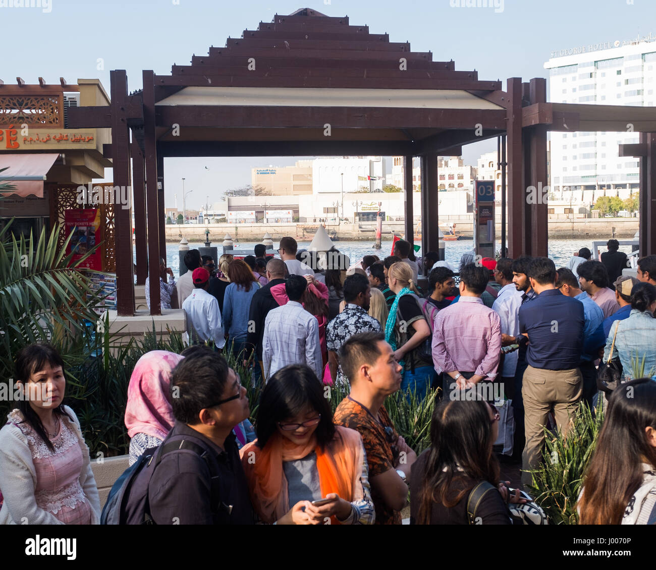 Queuing queue standing stand in line hi-res stock photography and ...