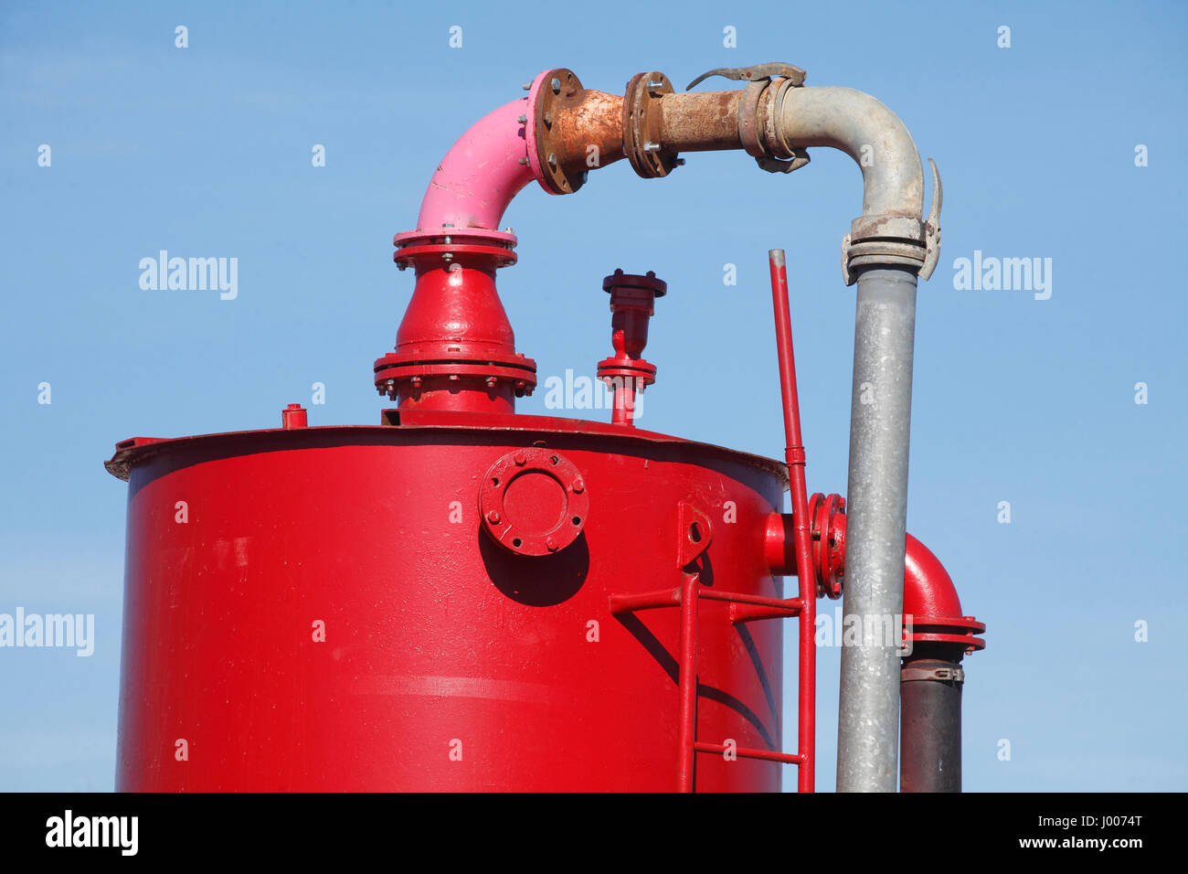 red metal pipe on a red kettle Stock Photo - Alamy