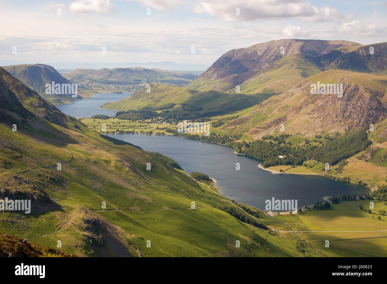 Buttermere village and lake, and Crummock Water, in a valley below the ...