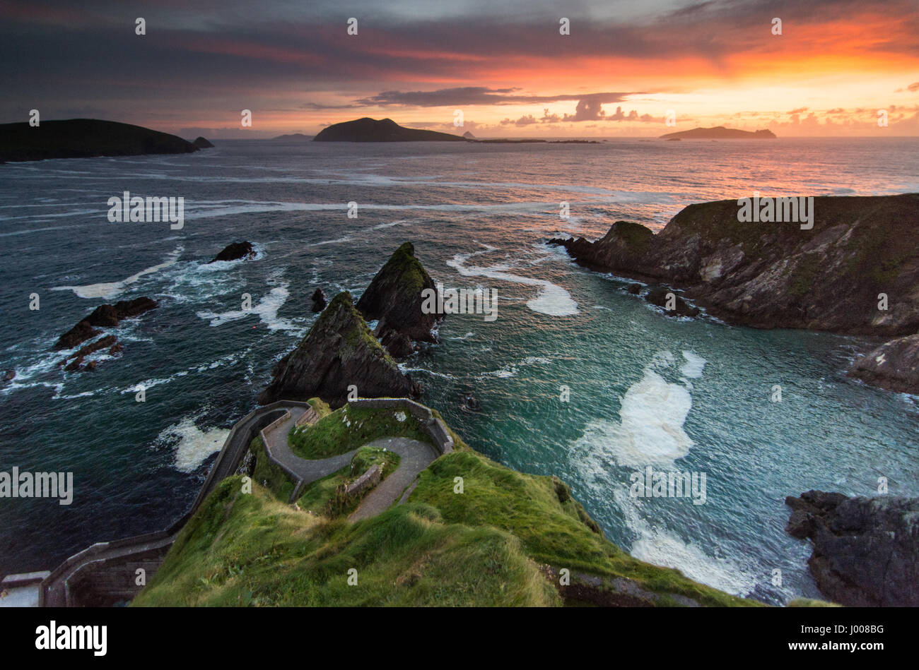 A narrow winding path leads down the cliffs at Dunquin on the Dingle ...