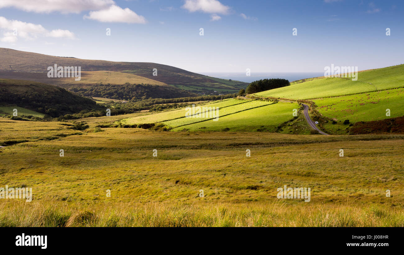 A narrow mountain pass leads down the slopes of Caherconree mountain ...